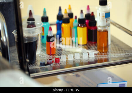 Work place of tattoo master Stock Photo - Alamy