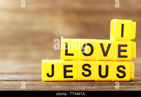 I LOVE JESUS sign illustrated with yellow plastic letters on wooden ...