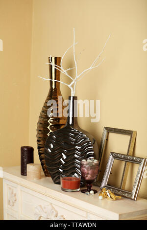 Modern vases with decor on fireplace in room Stock Photo - Alamy