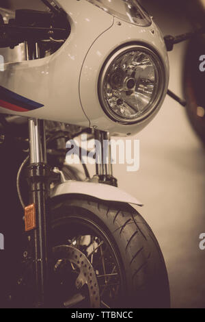 Close up of the front wheel of a classic motorcycle parked on the ...
