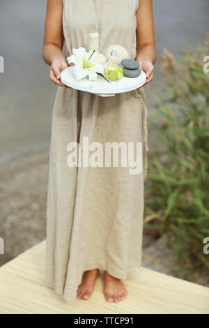 Female hands with tray of spa products, at spa salon Stock Photo - Alamy