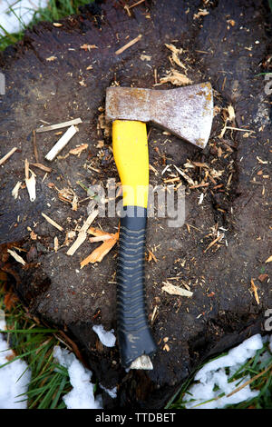 Used ax with plastic handle on wooden background Stock Photo - Alamy