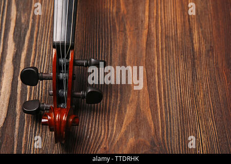 Violin neck on wooden background Stock Photo - Alamy