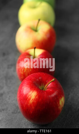 Apples on dark grey background Stock Photo - Alamy