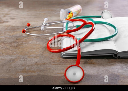 Stethoscopes on a book Stock Photo - Alamy