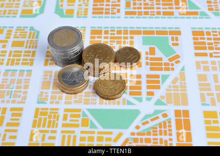 Euro coins on map background Stock Photo - Alamy
