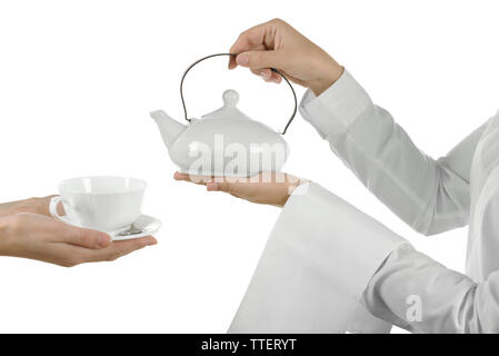 Waiter pouring tea to customer in cup isolated on white Stock Photo - Alamy