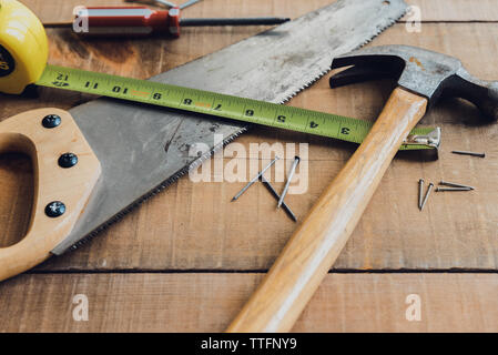 Close up of woodworking tools scattered on a wooden table Stock Photo ...