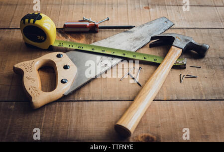 Woodworking tools scattered on a wooden table Stock Photo - Alamy
