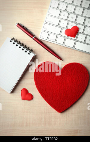 Computer peripherals with red hearts, notebook and mobile phone on ...