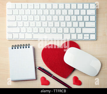 Computer peripherals with red hearts, notebook and mobile phone on ...