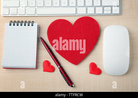 Computer peripherals with red hearts, notebook and mobile phone on ...