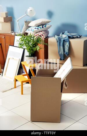 Packed household goods for moving into new house Stock Photo - Alamy