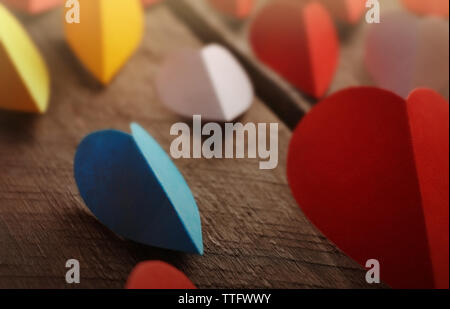 Varicolored paper hearts on wooden background, close up Stock Photo - Alamy