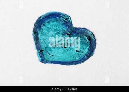 Turquoise painted colors heart on light background Stock Photo - Alamy
