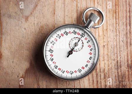 Stopwatch on wooden background, close up Stock Photo - Alamy