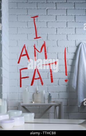 Text I AM FAT written on mirror in the bathroom Stock Photo - Alamy