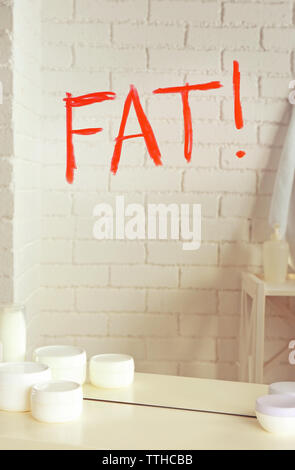 Word FAT written on mirror in the bathroom Stock Photo - Alamy