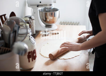 Midsection of woman working in kitchen at holiday villa Stock Photo - Alamy