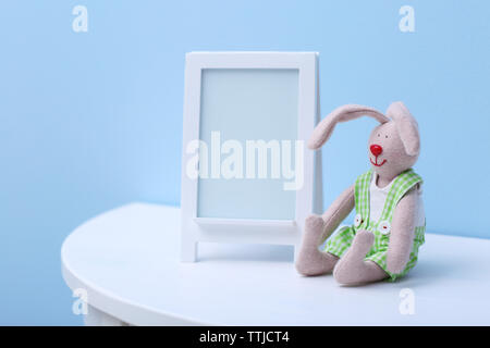 Baby toy on the table, light background Stock Photo - Alamy