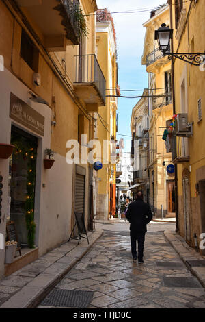 BARI, ITALY - FEBRUARY 9, 2019. Typical picturesque narrow street in ...