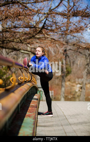 Woman practicing stretching exercise Stock Photo - Alamy