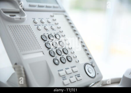 Office IP telephone on light background Stock Photo - Alamy