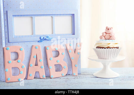 Word "Baby" with cupcake on bright background Stock Photo - Alamy