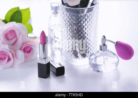 Opened lipstick on white dressing table Stock Photo - Alamy