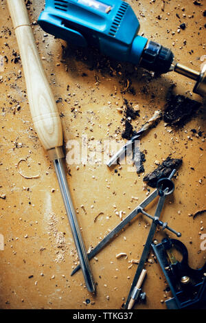 Tools on a messy workshop table Stock Photo - Alamy