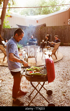 A man barbecuing Stock Photo - Alamy