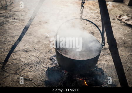 Stew cooking in utensil at barn Stock Photo - Alamy