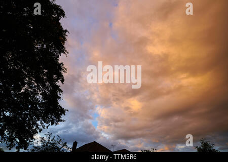 Evening skylight as the sun shines on rain clouds after a rainy day ...