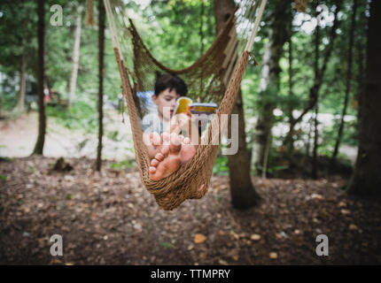 A boy in a hammock reading a book Photo: Christine Olsson / TT / code ...