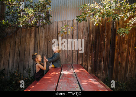 girls playing clapping hand games in field Stock Photo - Alamy