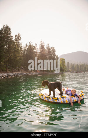Girl lying on raft Stock Photo - Alamy