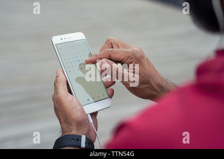 Close-up Of A Man Looking At Calendar In Digital Tablet Stock Photo - Alamy