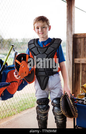 Little league baseball catcher standing up at home plate looking Stock ...