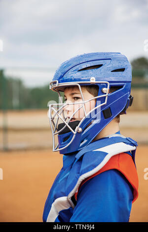 Little league baseball catcher standing up at home plate looking Stock ...