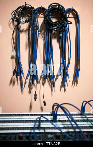 Electrical cables hanging on a wall backstage in a theater Stock Photo ...