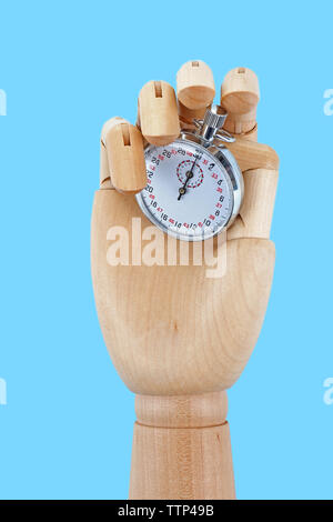 wooden model dummy holding pocket watch isolated on white background ...