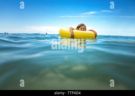 Girl Floating in Water Stock Photo - Alamy