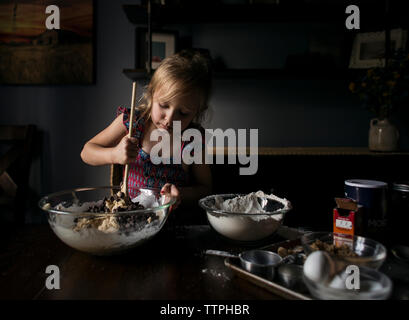 Ingredients in mixing bowls on the counter to bake chocolate cookies ...