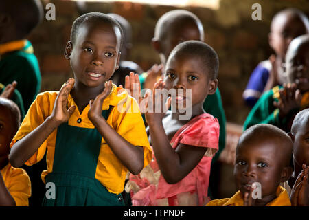 Students clapping hands Stock Photo - Alamy