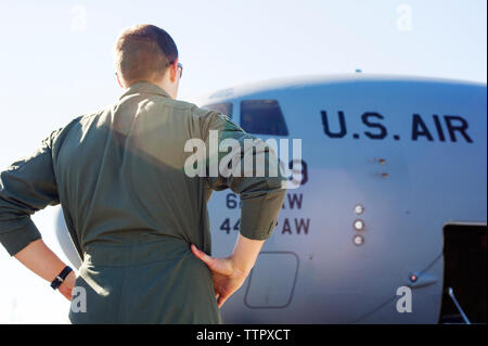 Rear view of soldier standing with his hands behind back Stock Photo ...