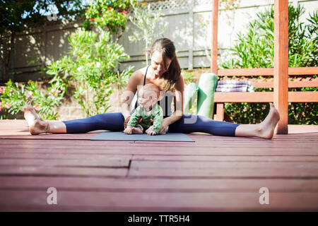 Mother doing sports with her baby son Stock Photo - Alamy