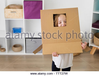 Girl wearing a cardboard box Stock Photo: 8880218 - Alamy