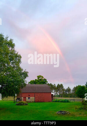 Rainbow against the sunset sky Stock Photo - Alamy
