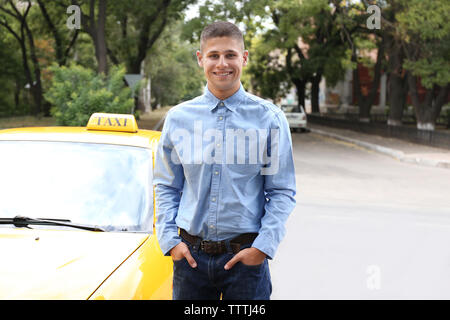 Male taxi driver near car Stock Photo - Alamy