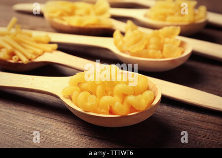 Different dry pasta on measuring spoons Stock Photo - Alamy